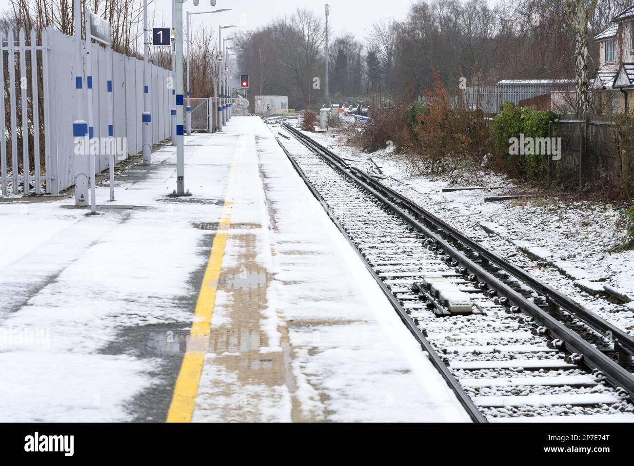 London UK, 8th March 2023. UK Weather. Train platform covered in heavy ...