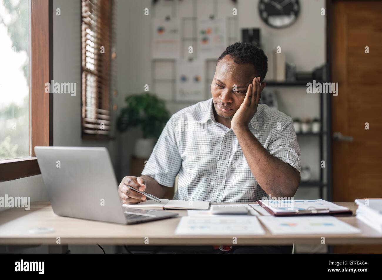 Tired depressed bored Africans businessman frustrated by business ...