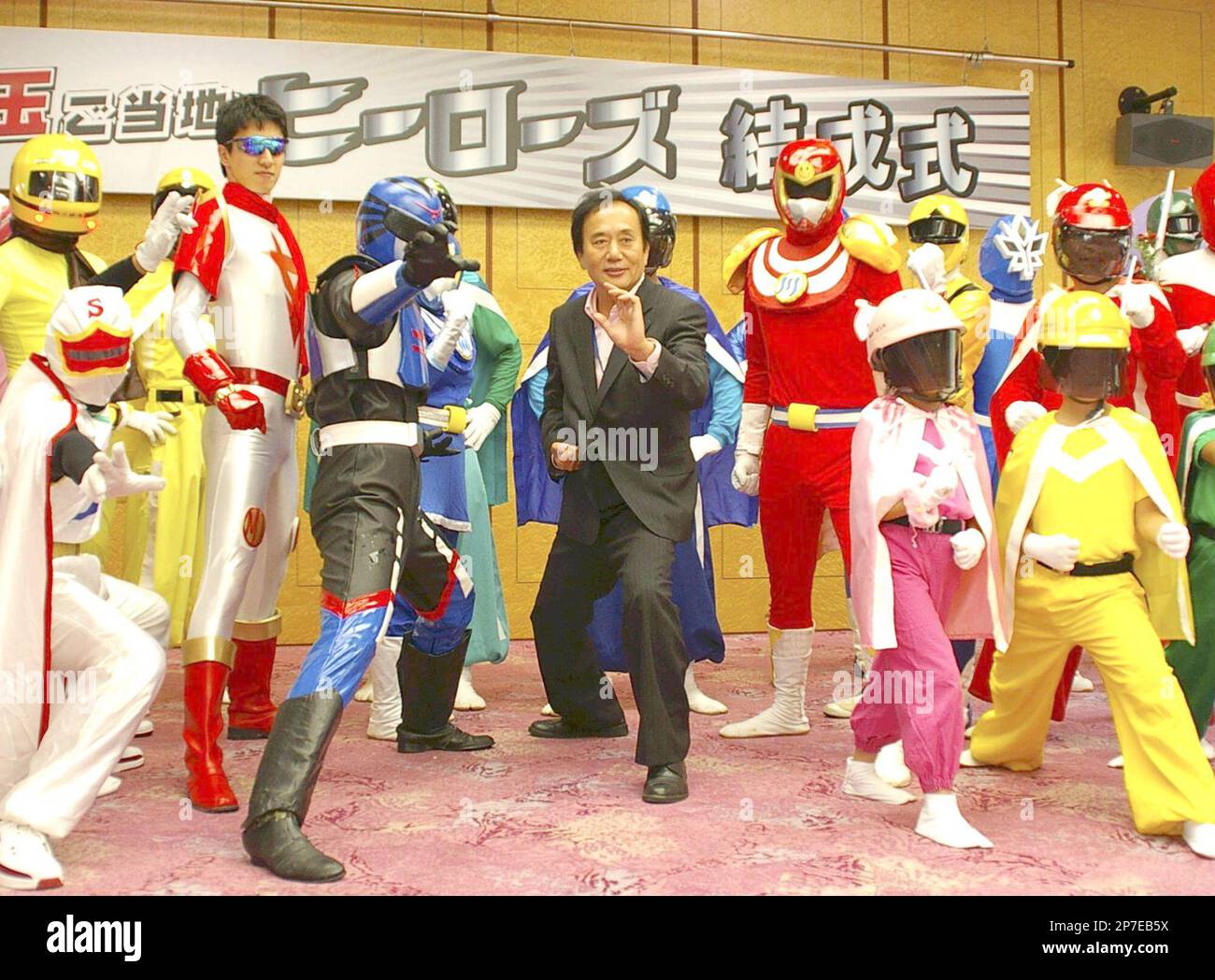 Kiyoshi Ueda,center, a governor of Saitama Prefecture, gestures a ...