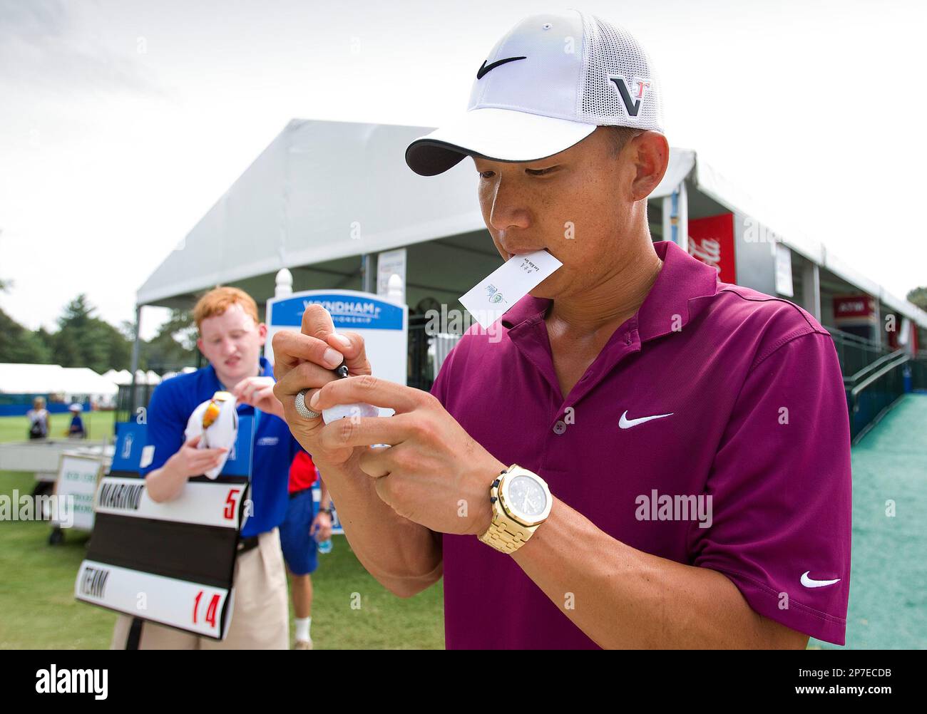 Anthony Kim signs a golf ball after his round in the Wyndham ...