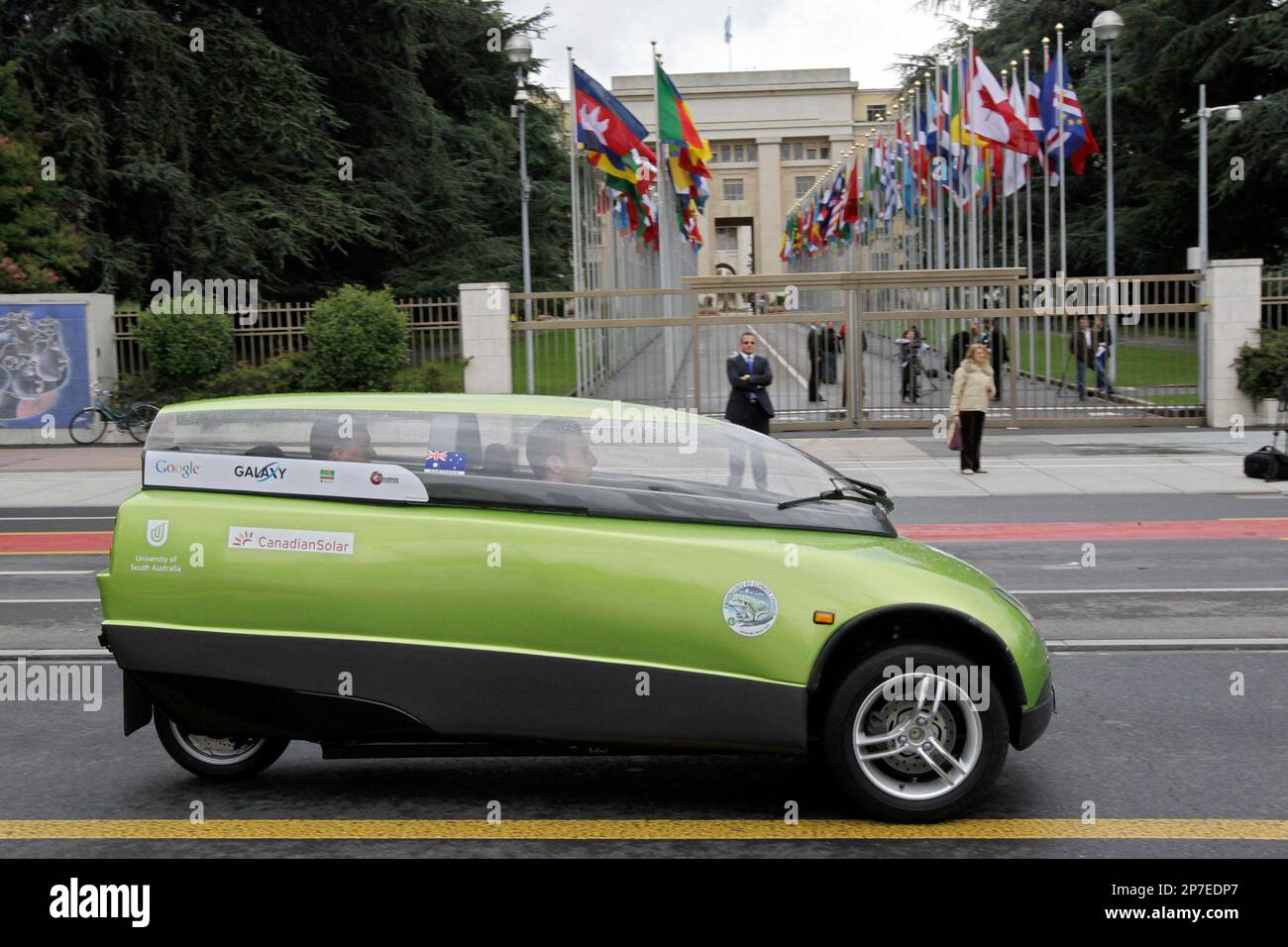 The electric vehicle of Team Trev from Australia passes in front of the ...