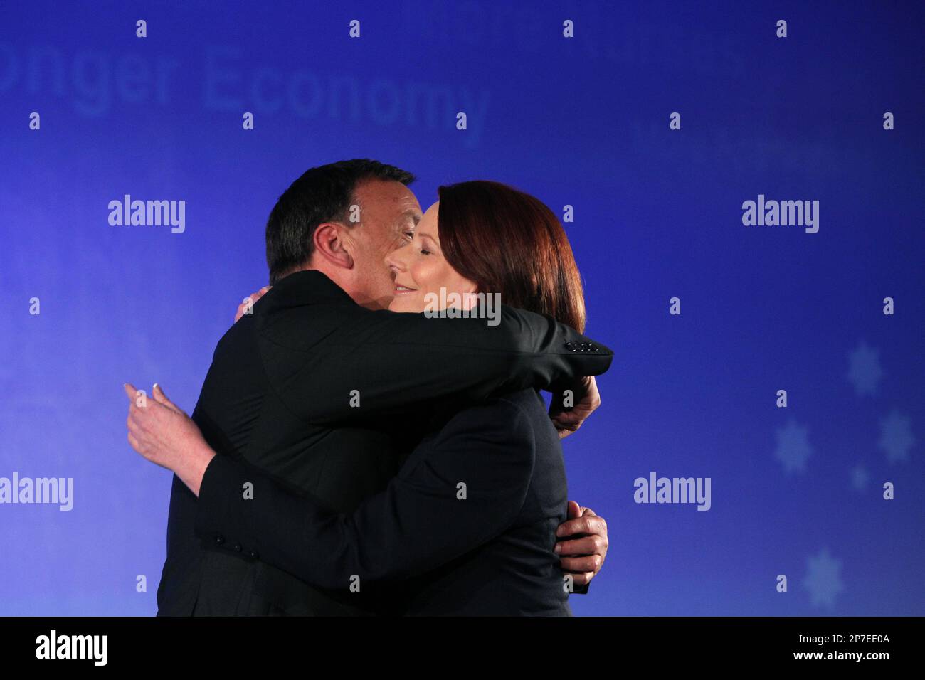 Australian Prime Minister Julia Gillard embraces her partner Tim ...
