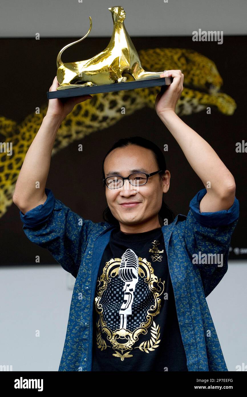 Chinese director Li Hongqi poses with the Golden Leopard, the top ...