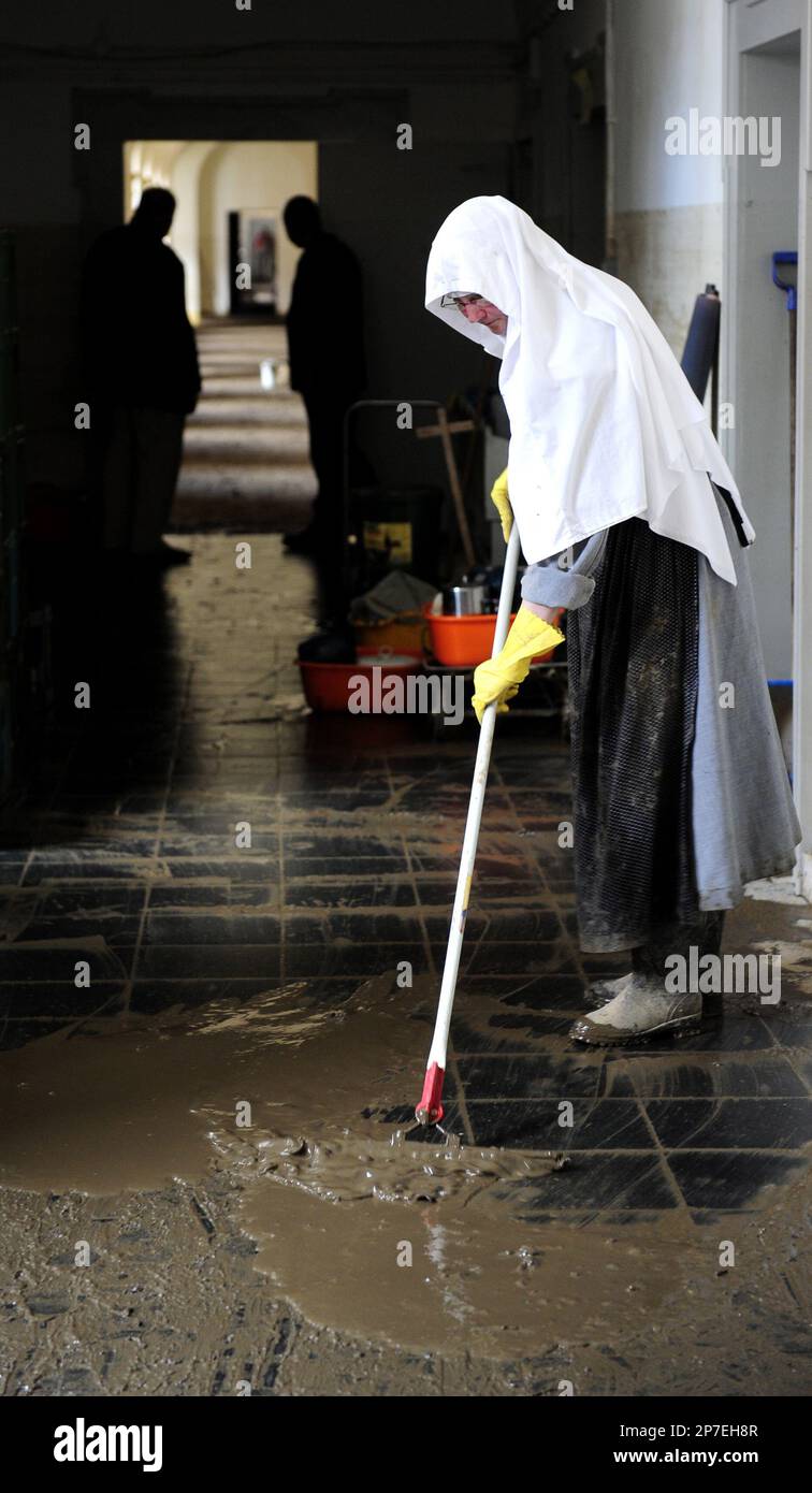 A nun cleans the floor in the St. Marienthal monastry in Ostritz ...