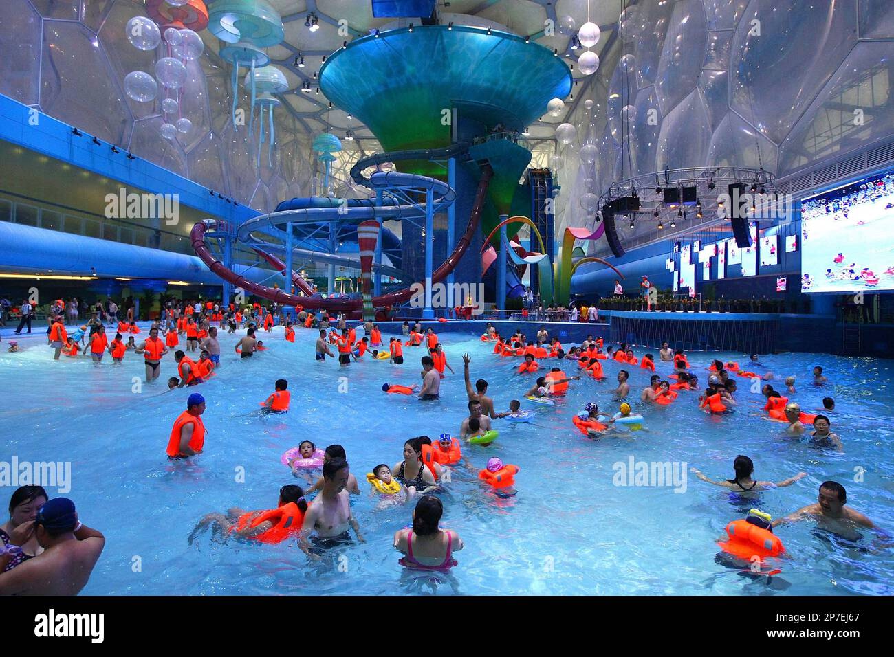 People play with water at the Asia's largest indoor water park at the ...