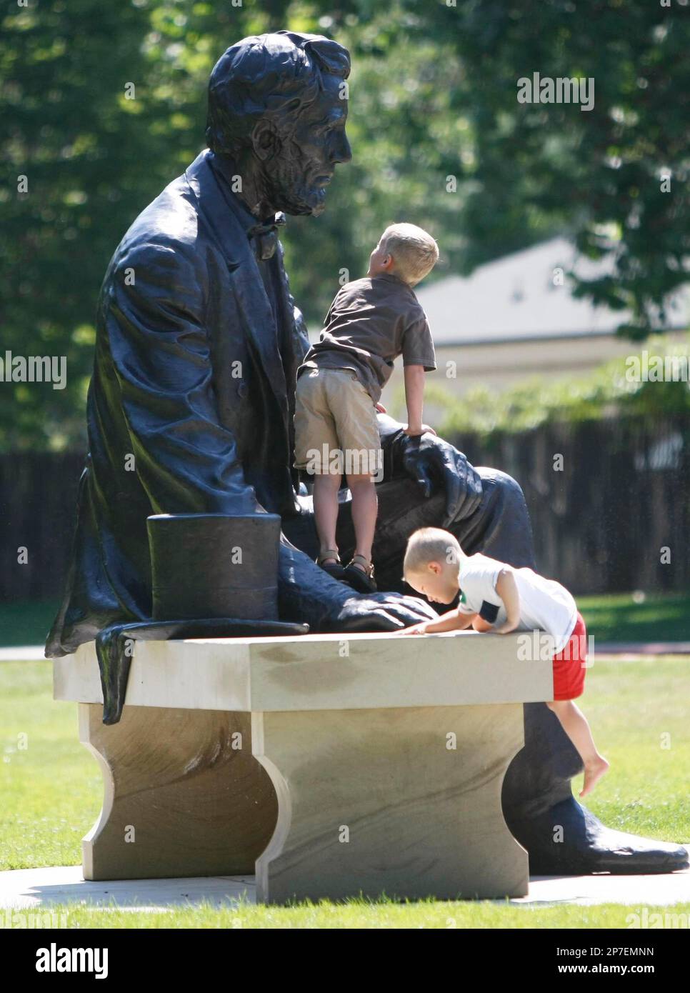 Nathan Jantzen, 6, and younger brother Ethan, 4, Meridian, climb onto ...