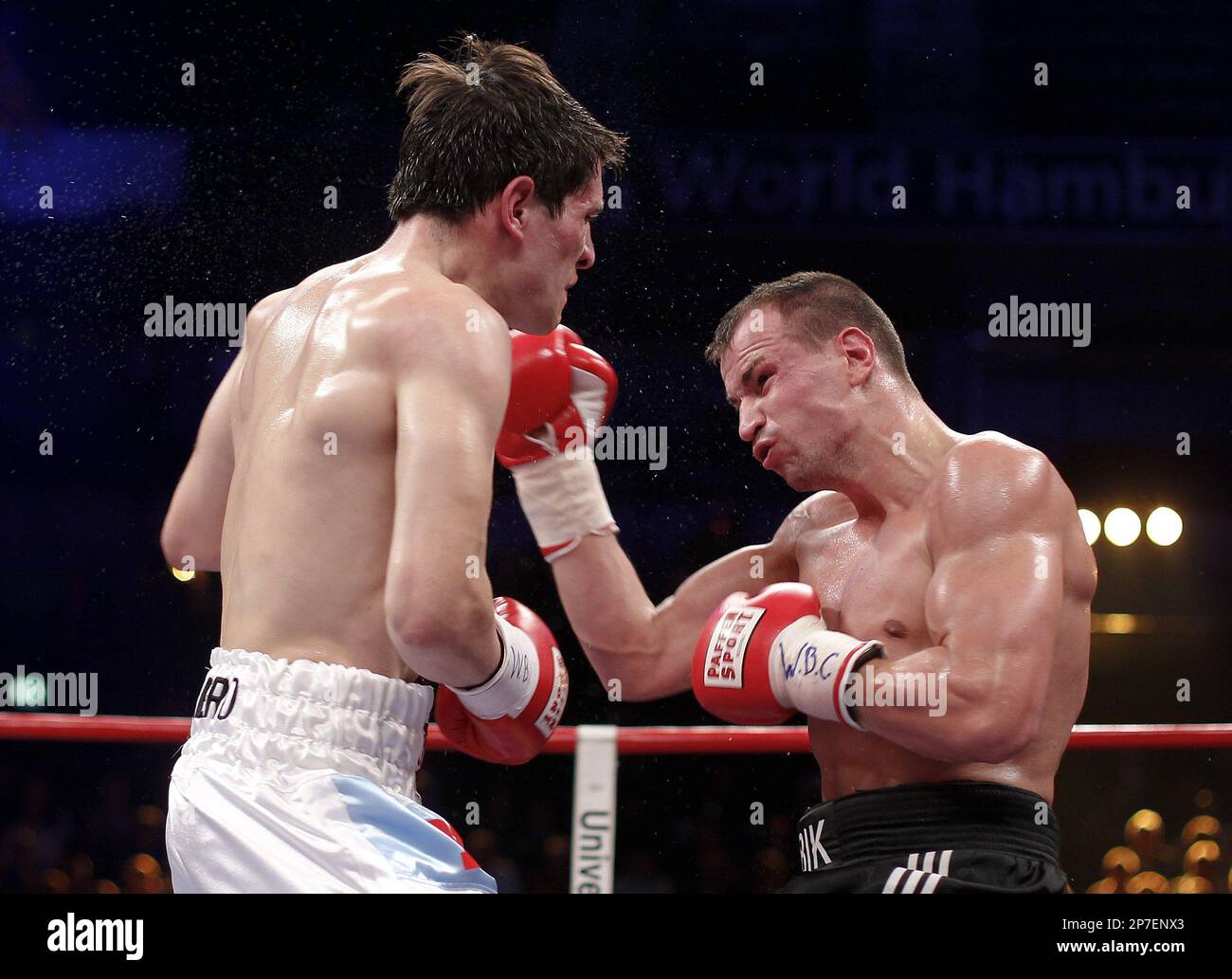 German boxer Sebastian Zbik, right, punches Argentinian boxer Jorge ...