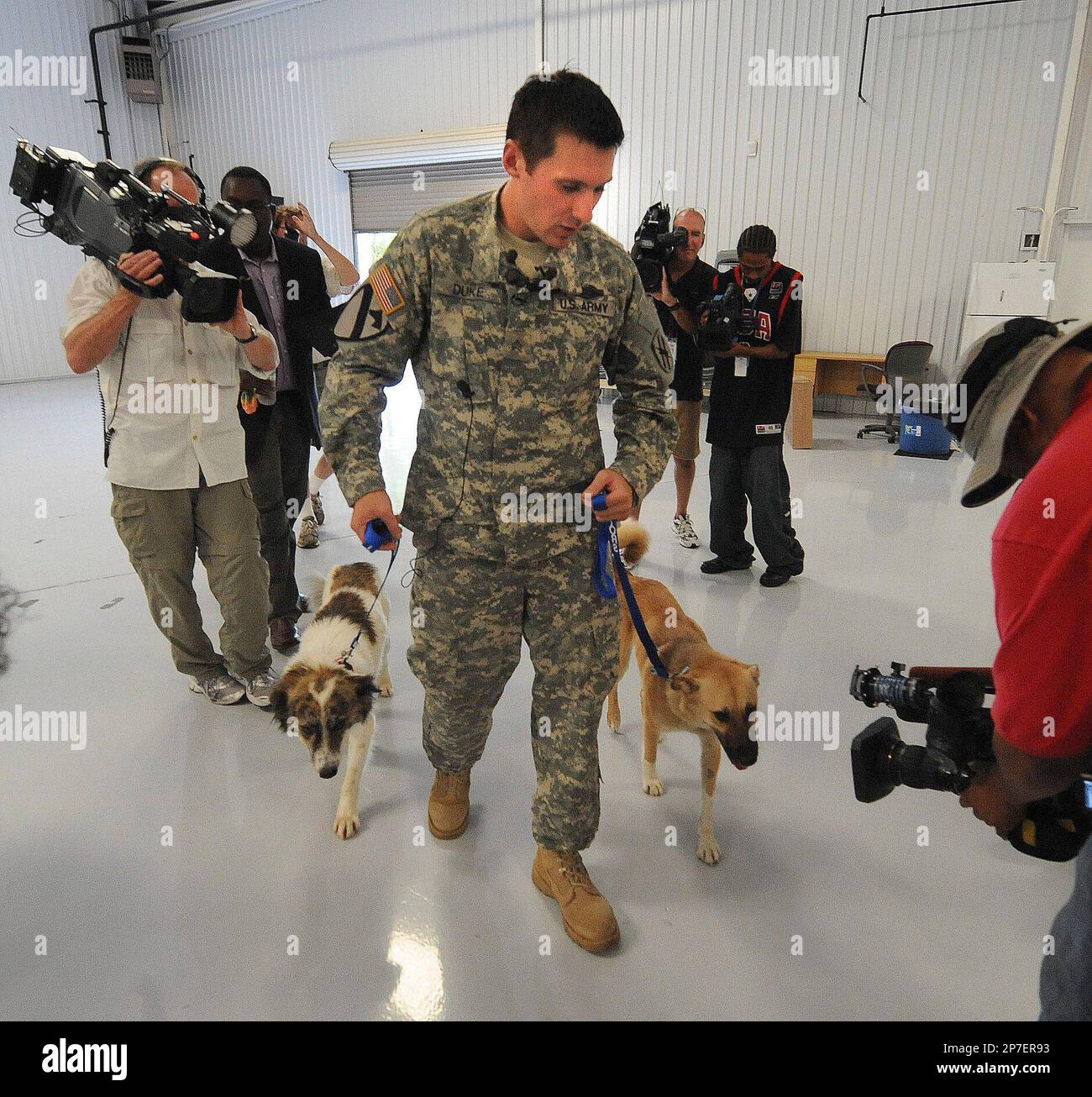 Sgt. Christopher Duke walks Rufus, left, and Target at PetAirways on ...