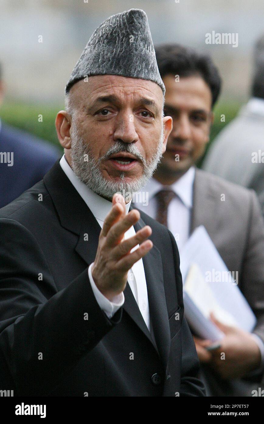 Afghanistan's President Hamid Karzai , left and Sadako Ogata , right ...