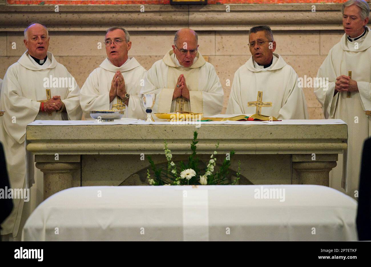Members of the clergy, including Bishop Joseph A. Pepe, center, pray ...