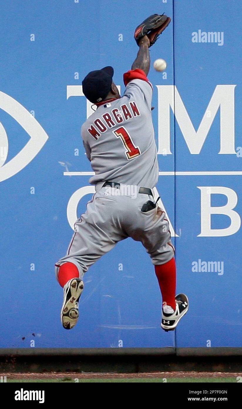 Washington Nationals center fielder Nyjer Morgan just misses catching a ...
