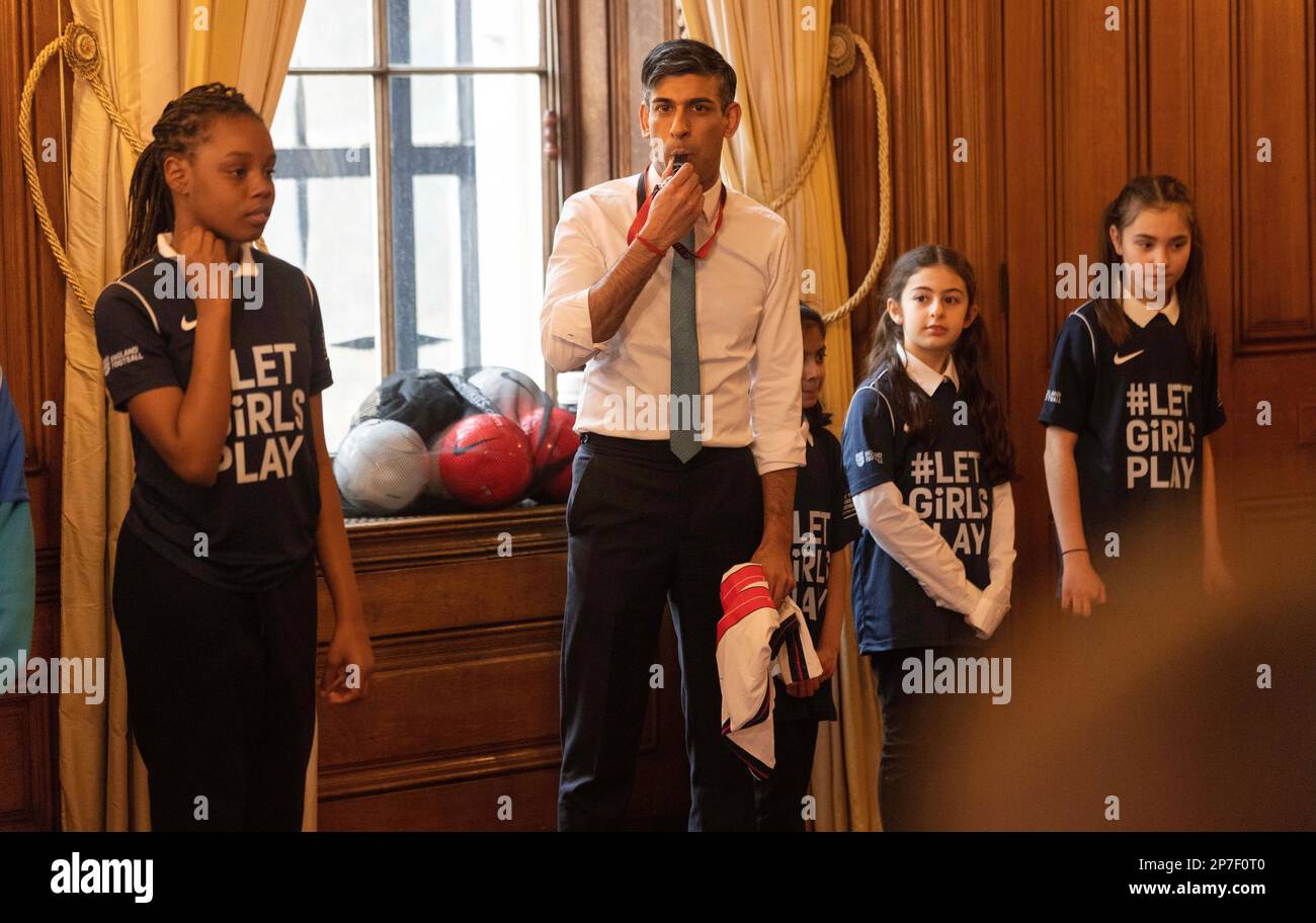 Prime Minister Rishi Sunak blows a whistle as he hosts current and ...