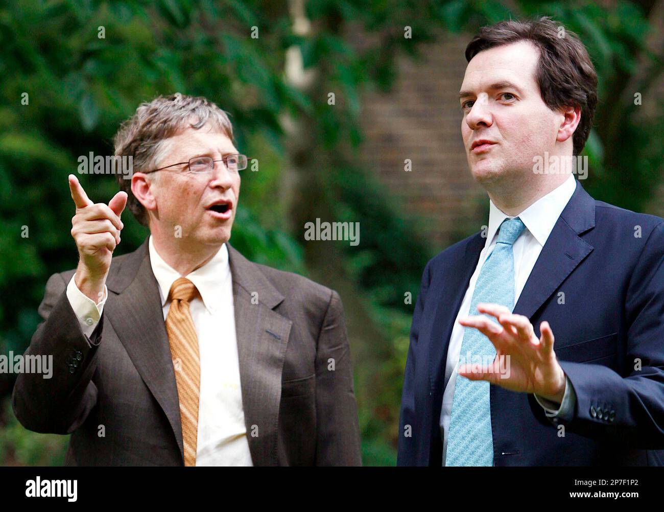 Bill Gates, founder of Microsoft Corp., left, speaks with Britain's ...