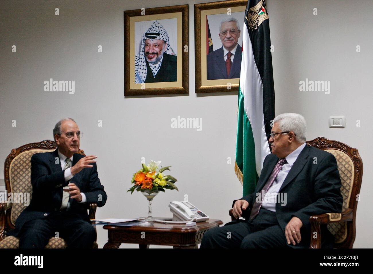 U.S. Mideast envoy George Mitchell, left, gestures as he speaks with ...