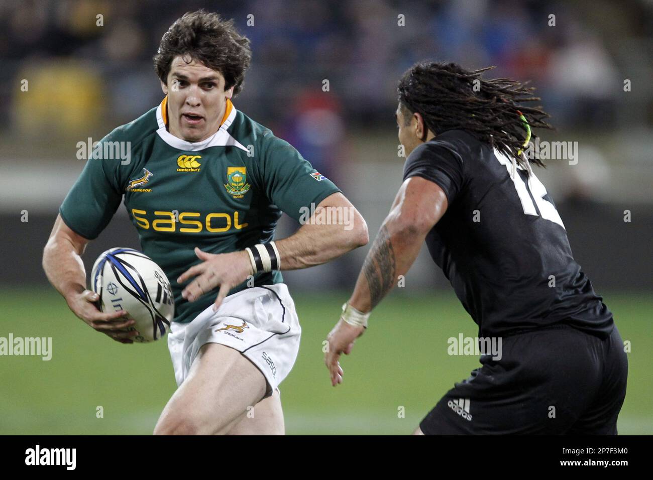 South Africa's Jaque Fourie looks to get past New Zealand's Ma'a Nonu ...