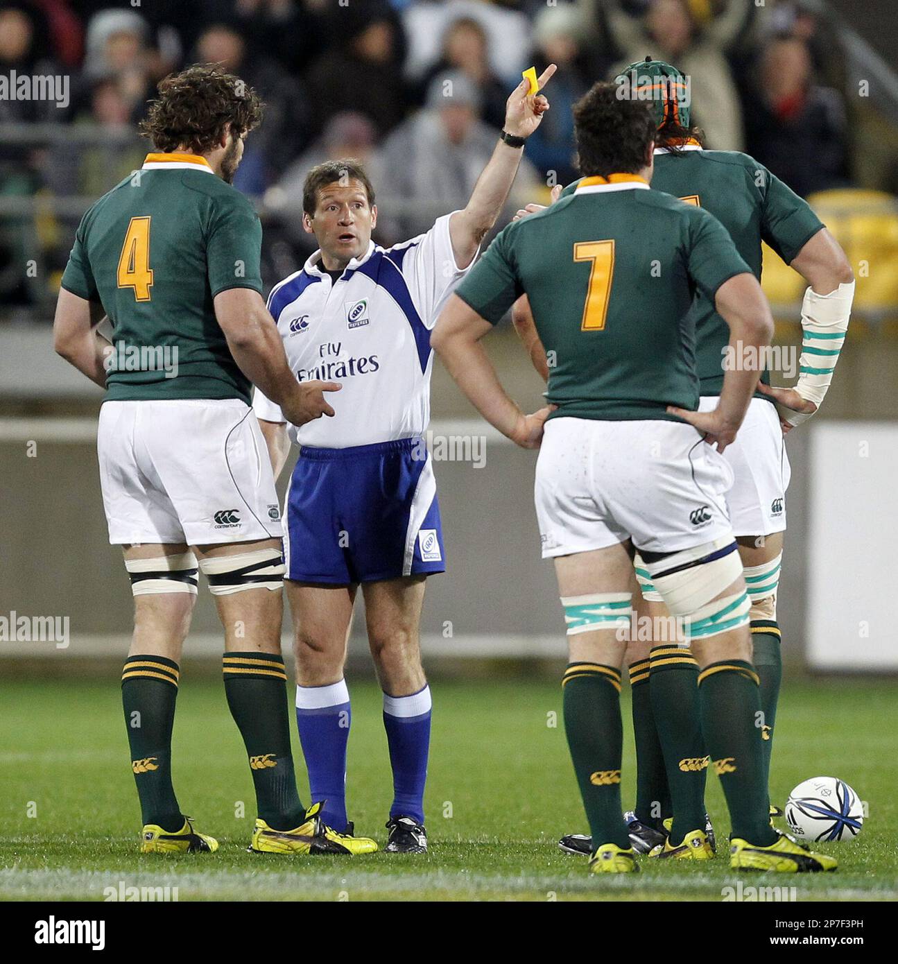 South Africa's Danie Rossouw, left, is shown a yellow card by referee ...