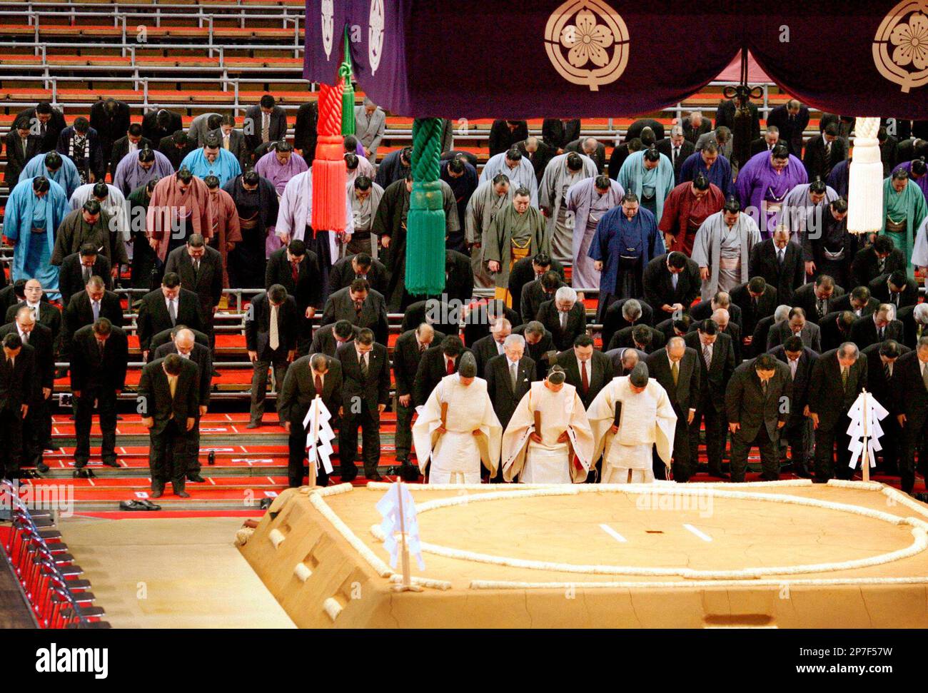 In this photo taken Saturday, July 10, 2010, sumo wrestlers and ...