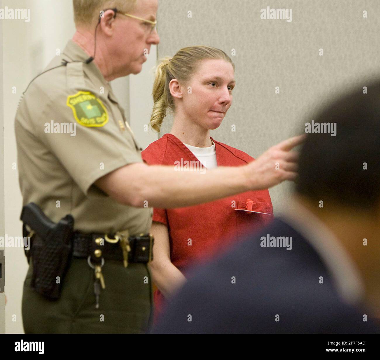 Stephanie Sloop enters the courtroom to appear before Judge Michael ...