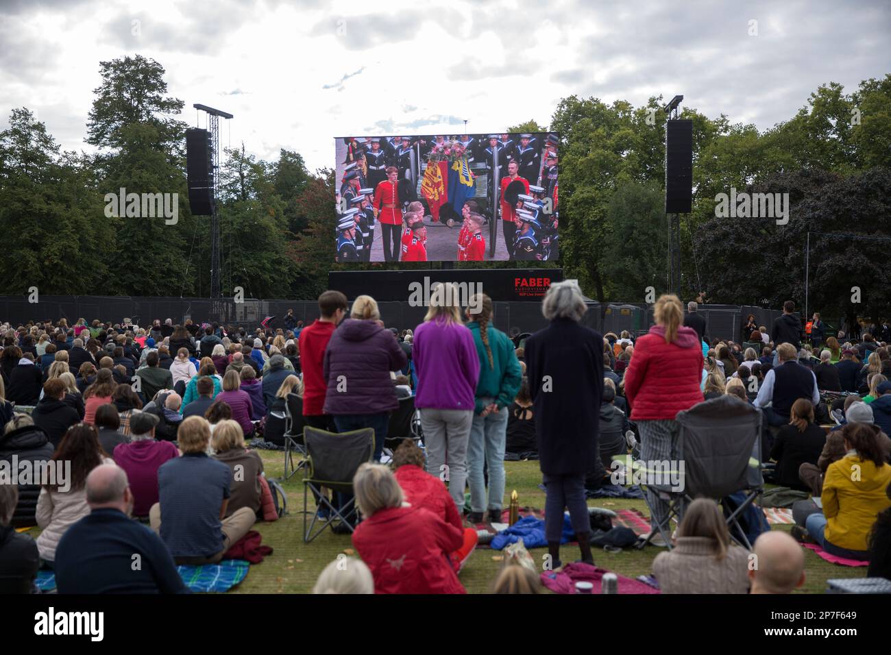 People watch the TV coverage of the late Queen Elizabeth II’s funeral ...