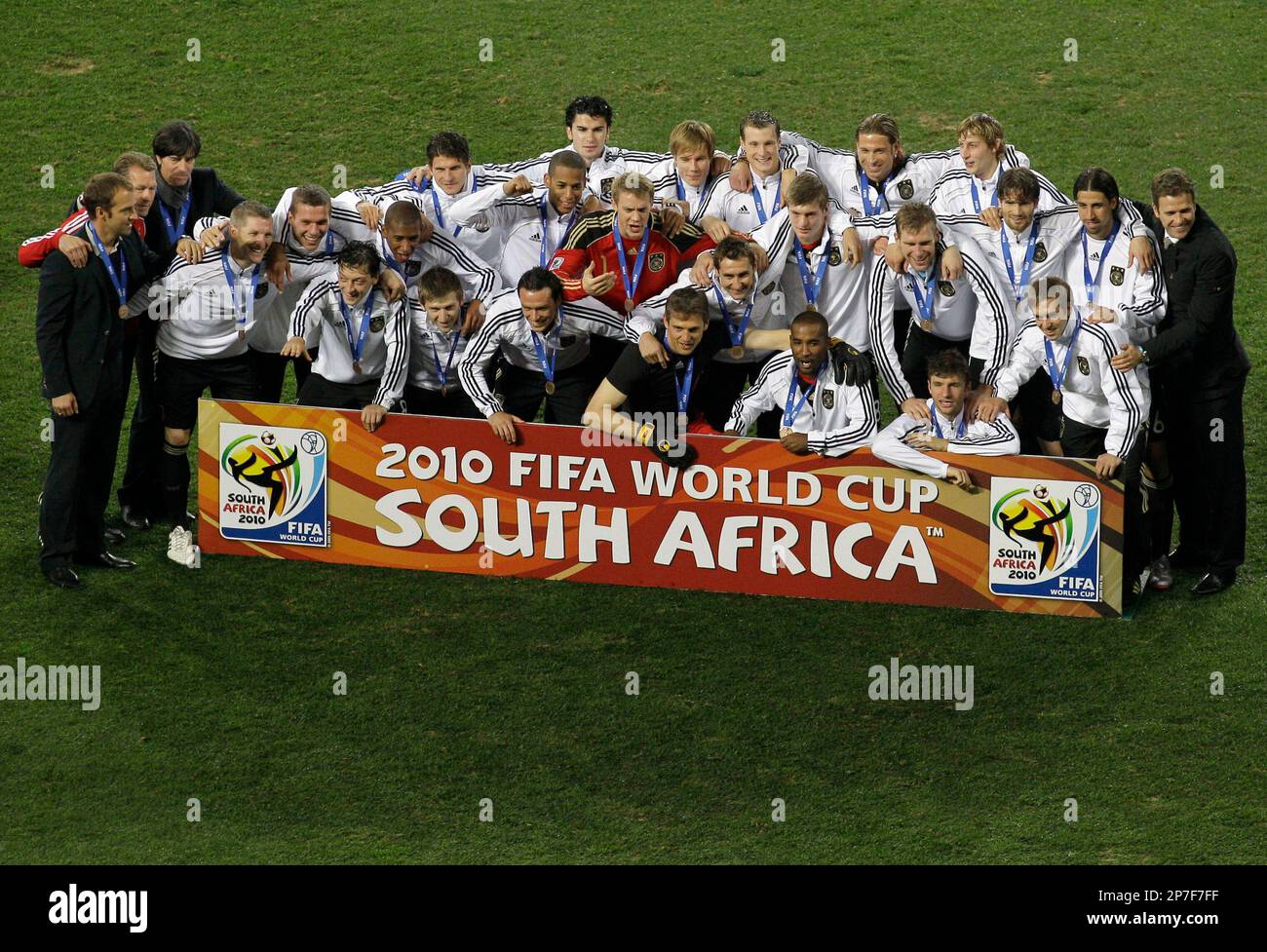 Germany players pose with their bronze medals at the end of the World ...