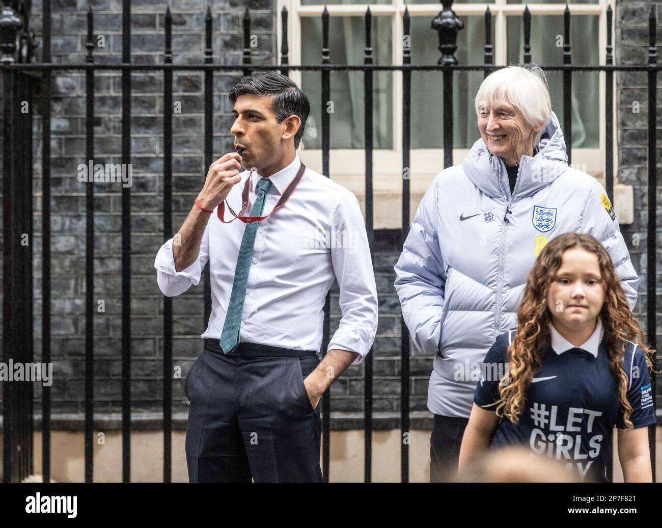 British Prime Minister Rishi Sunak blows a whistle as he hosts current ...