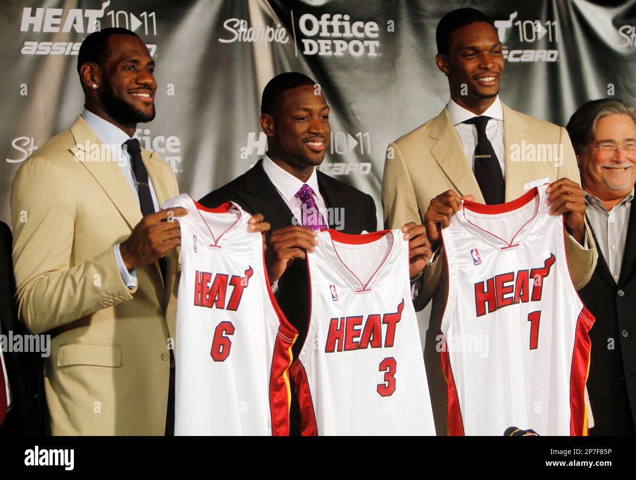 LeBron James (6), Dwyane Wade (3) and Chris Bosh (1) show off their ...