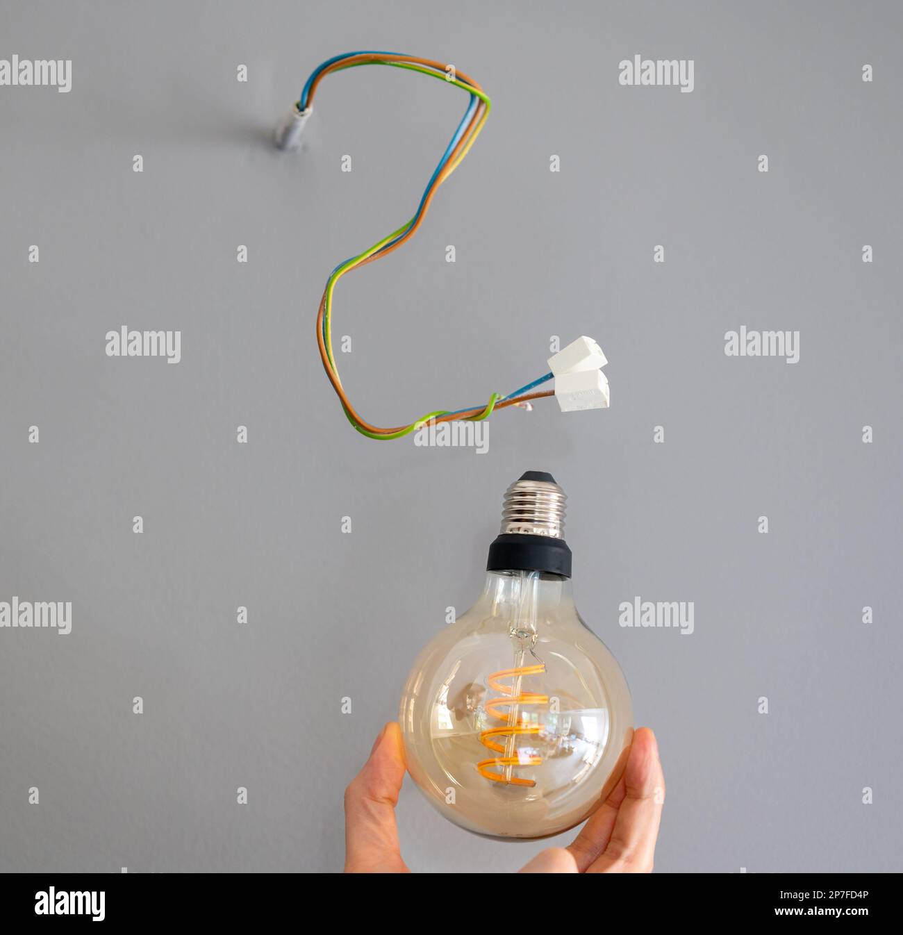 Symbol for installing light in a renovated house. Light cable in a grey ...