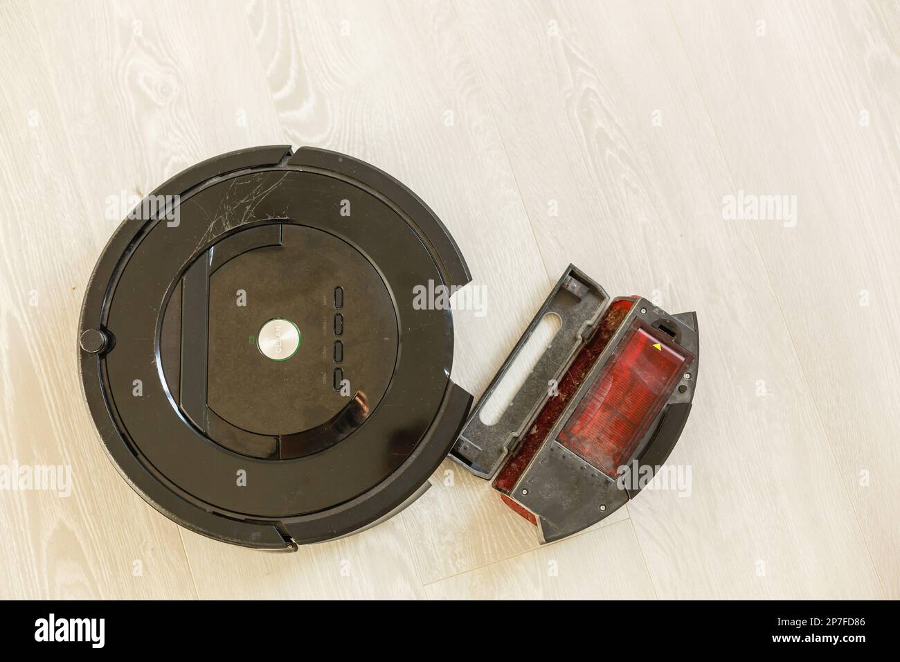 Robot vacuum cleaner on laminate wood floor, Smart robotic automate ...