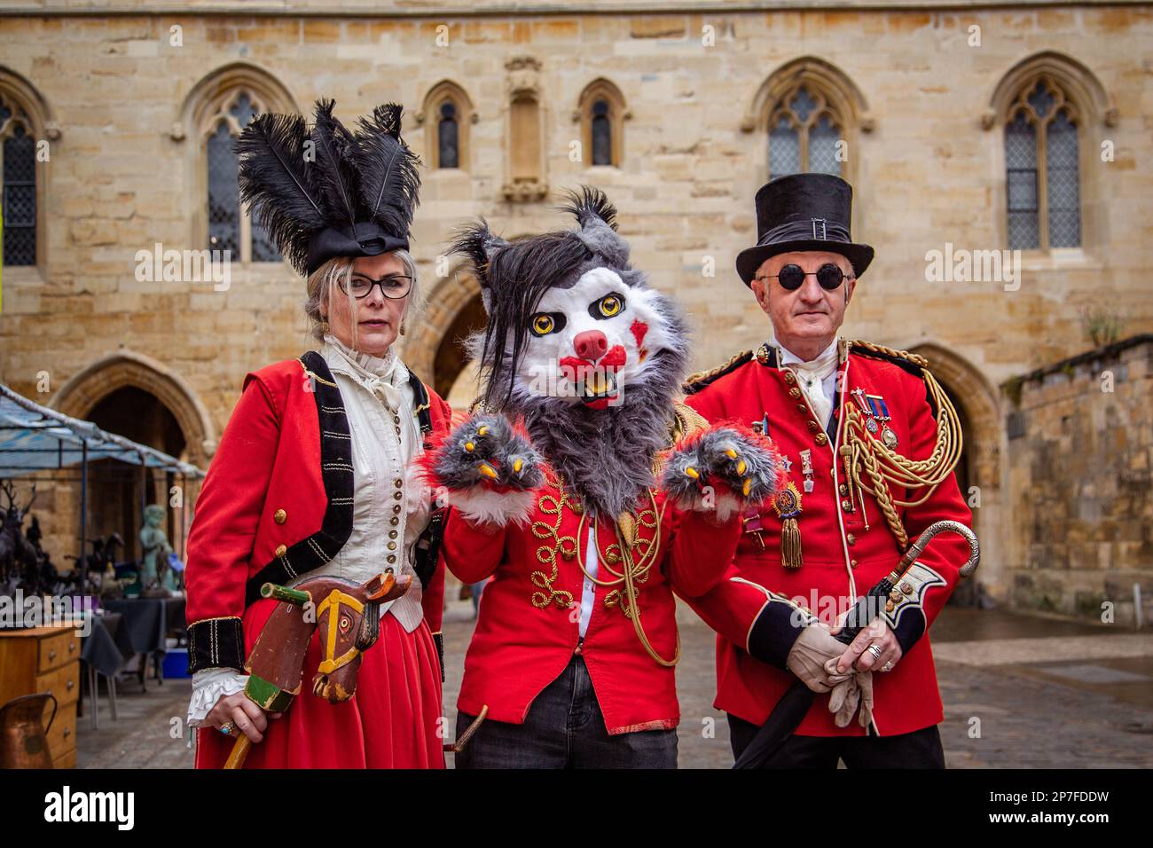 A middle aged steampunk family wearing red uniforms Stock Photo - Alamy