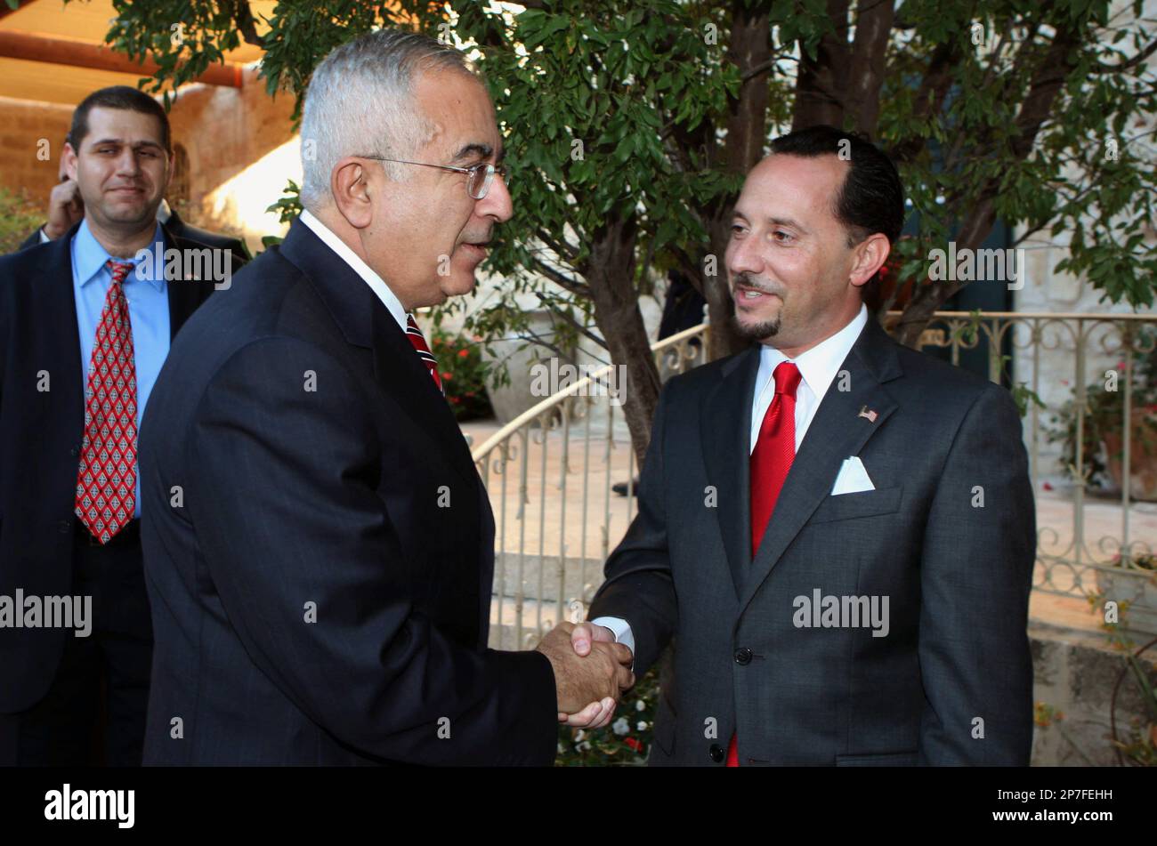 U.S. Consul General of Jerusalem Daniel Rubinstein, right, shakes hands ...