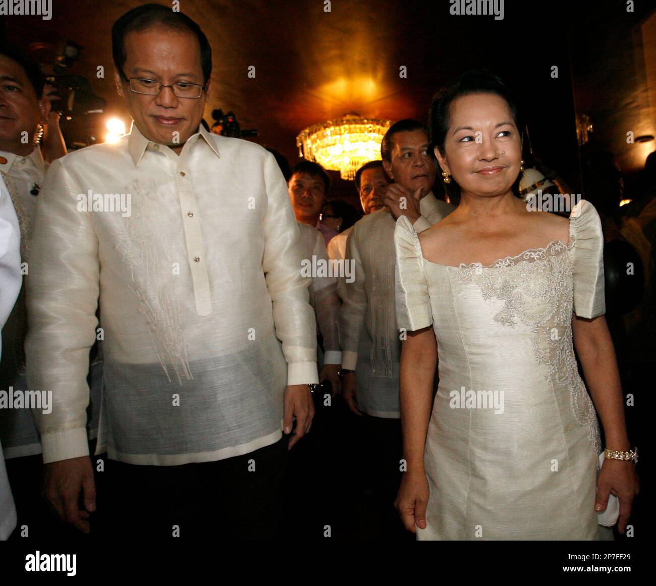 Outgoing Philippine President Gloria Macapagal Arroyo, right, walks ...