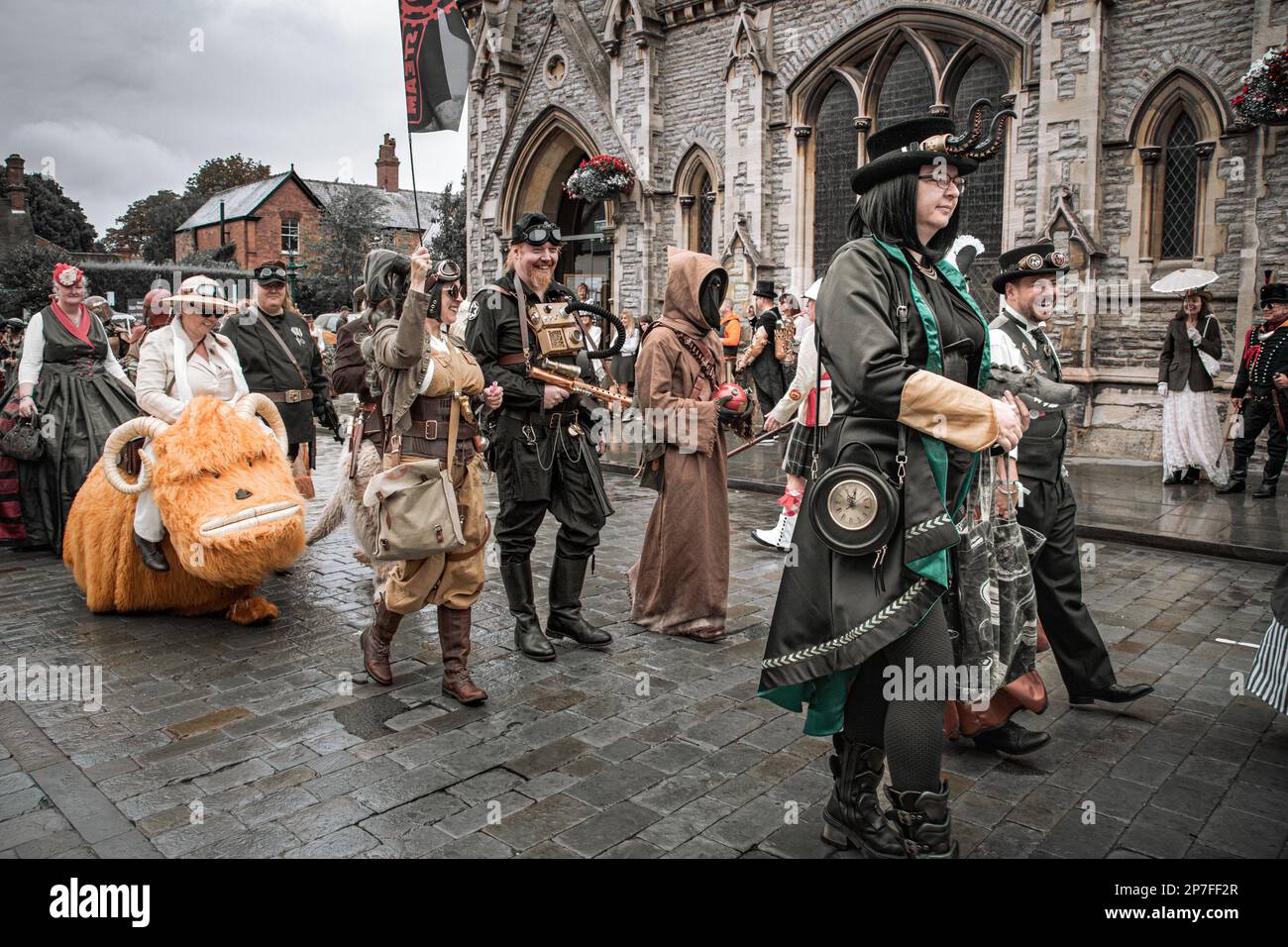 A group of steampunks walking in procession along a street Stock Photo ...