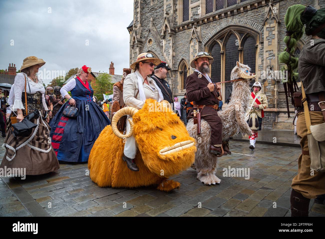 Steampunks riding fantasy animals in s street procession Stock Photo ...