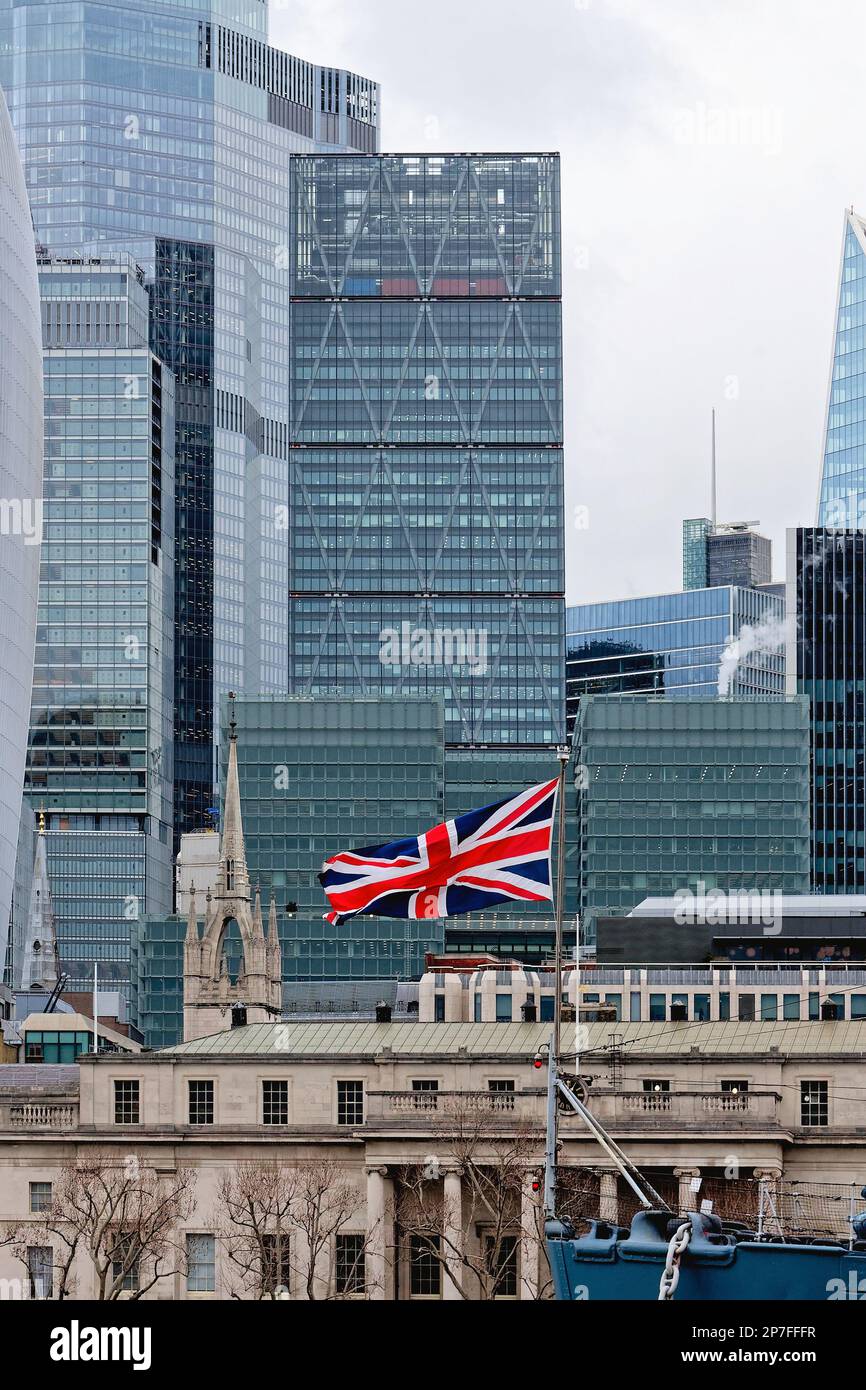 A single Union Jack flag flying against a background of the city of ...