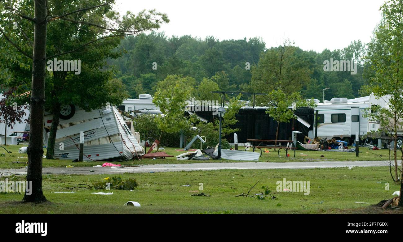 Over turned recreational vehicles lay scattered after a severe storm ...