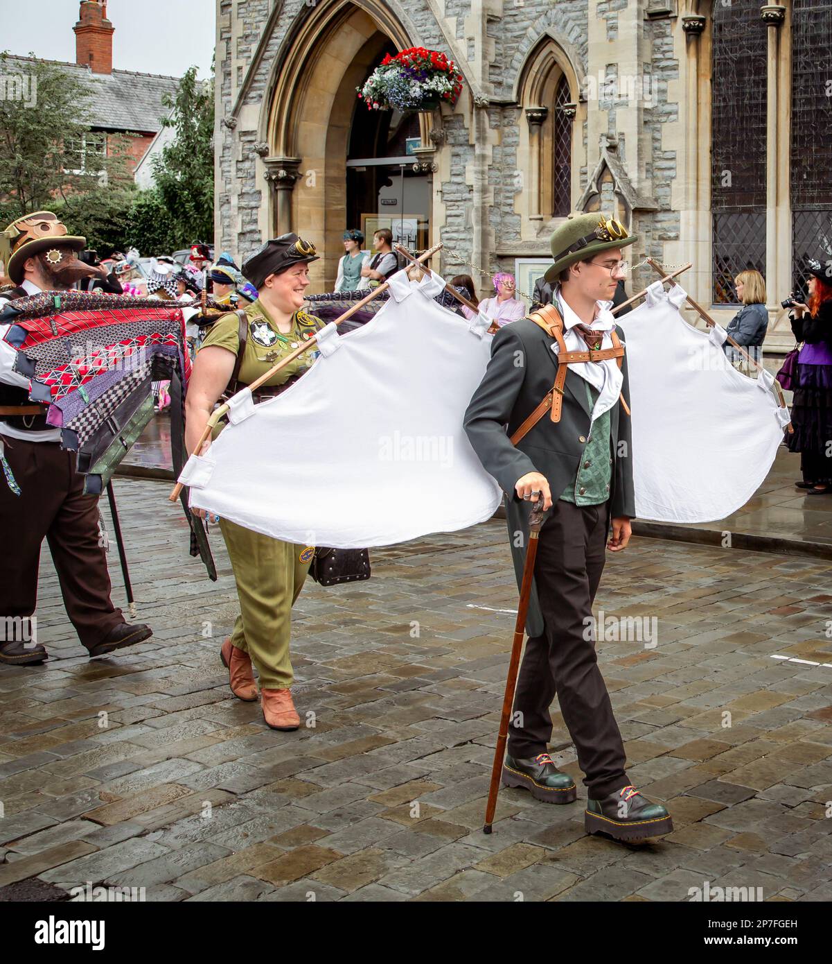 A group of steampunks walking in procession along a street Stock Photo ...