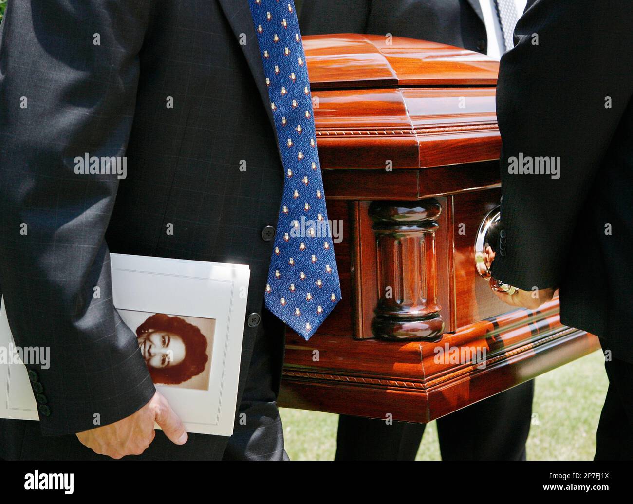 Pallbearers carry the casket bearing the body of Hannah Atkins from the ...