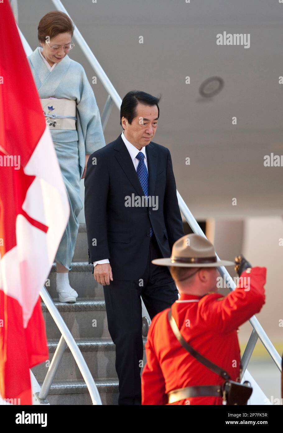 Japan's Prime Minister Naoto Kan and his wife Nobuko arrive to ...