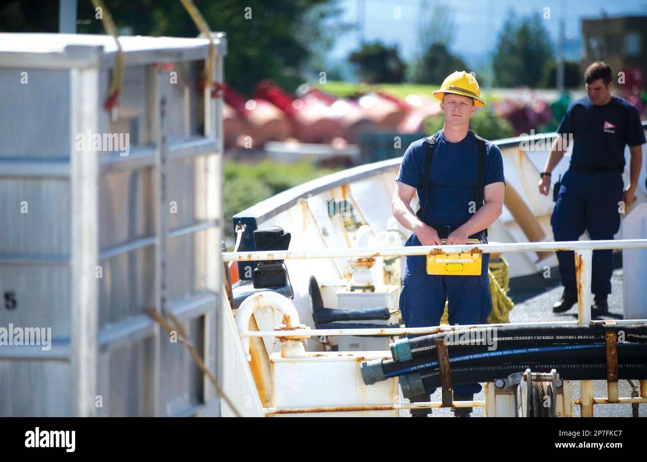 Boatswain's Mate Dan Beekman operates the United States Coast Guard ...