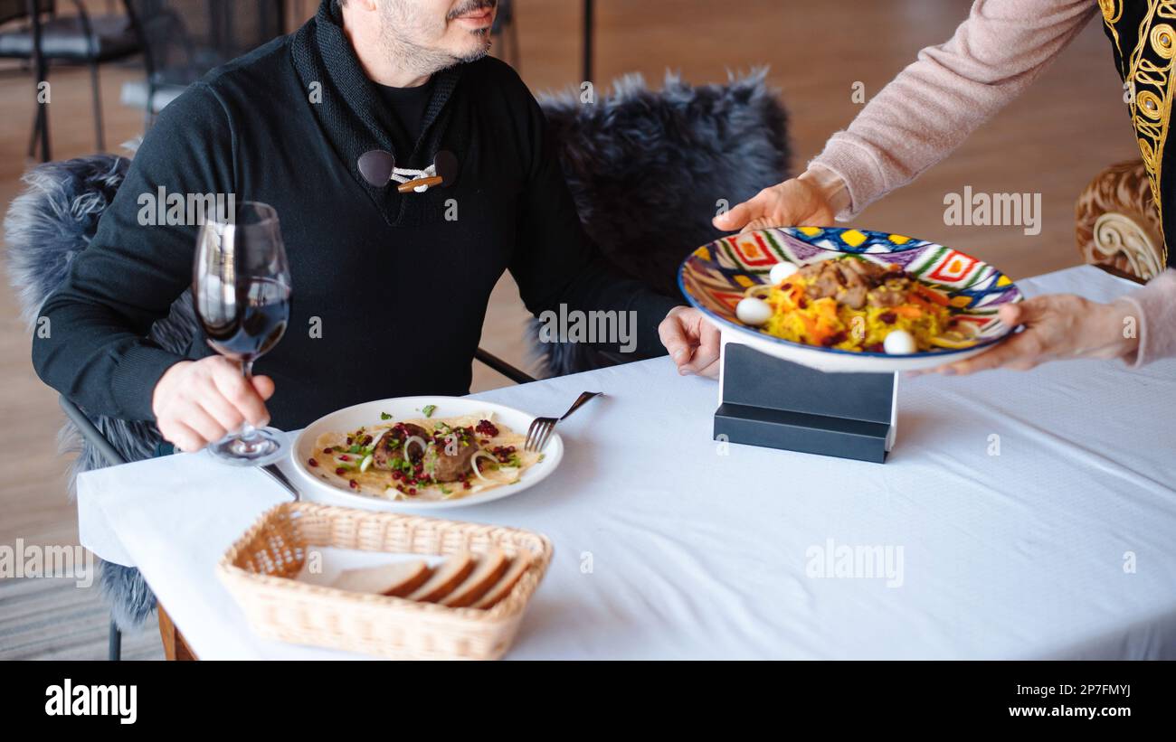 Anonymous man eating restaurant hi-res stock photography and images - Alamy