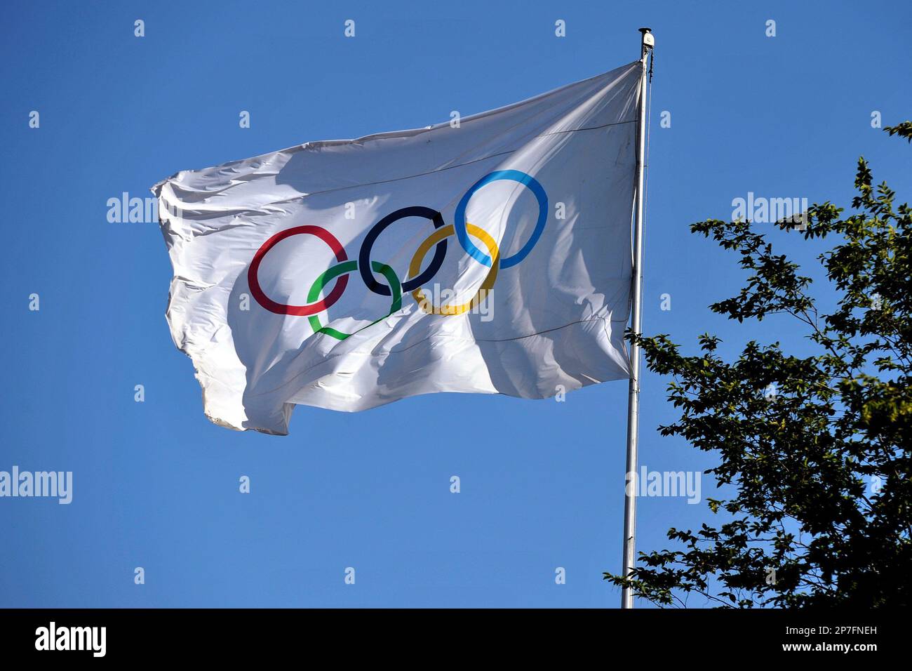 An IOC flag waves at the IOC headquarters in Lausanne, Switzerland ...