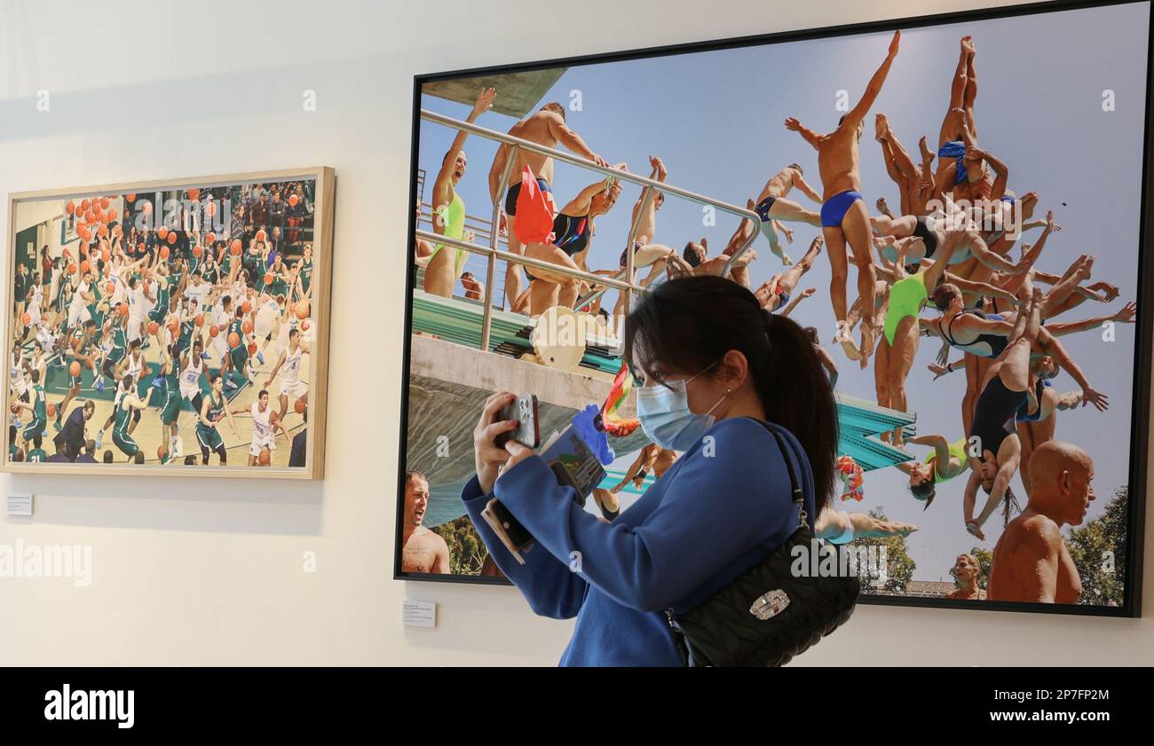 Visitors look at exhibits in the HHelle Cass: PhotographsHH the artist ...