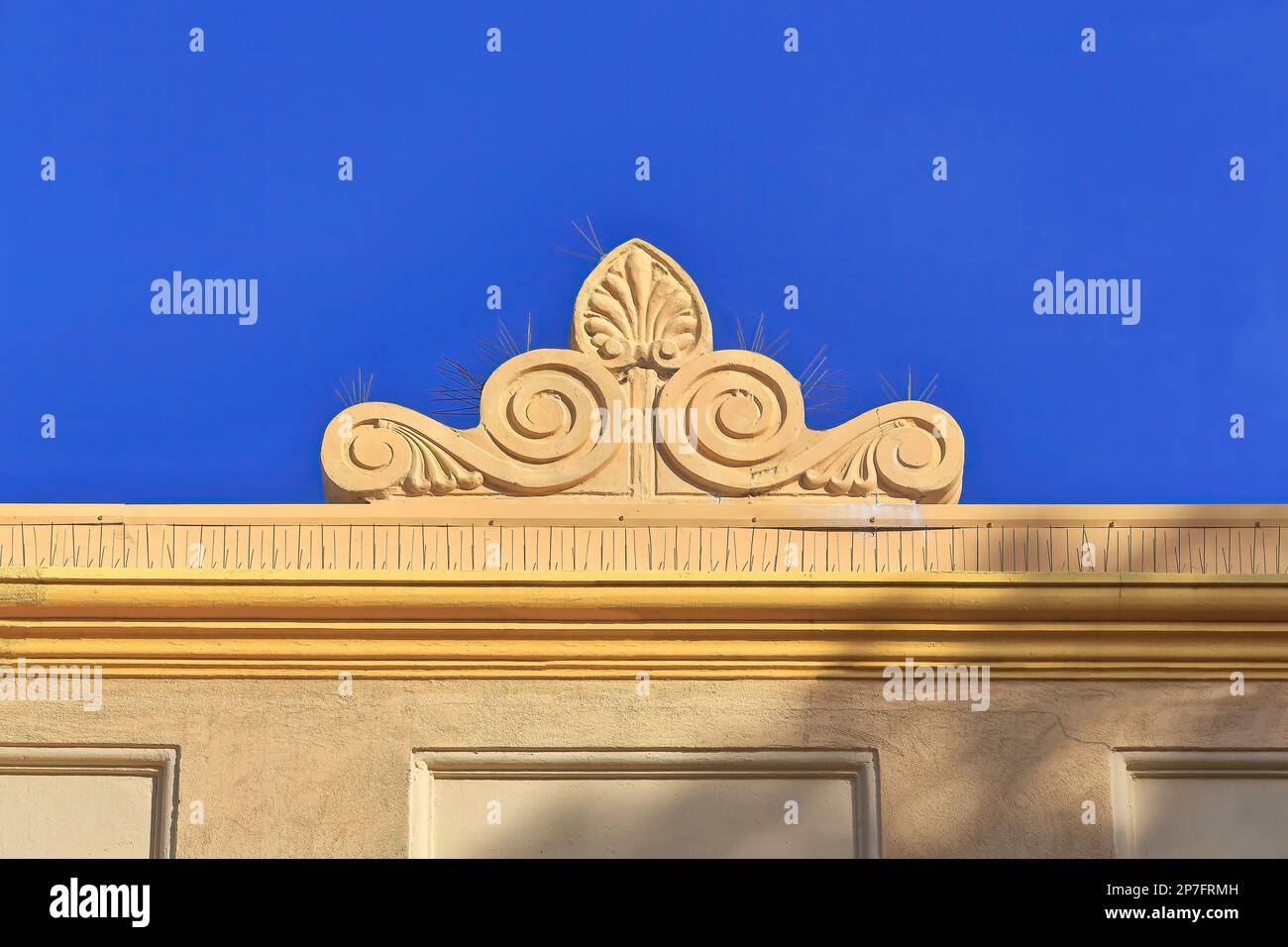 530 Baroque roof finial with acroterion atop an orange-yellow painted ...