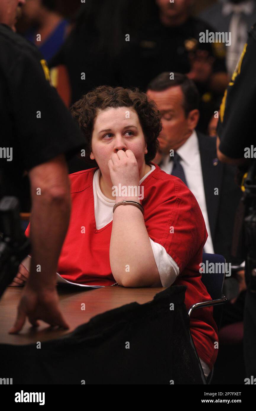 Melissa Huckaby is seated during her transcript unsealing process in ...