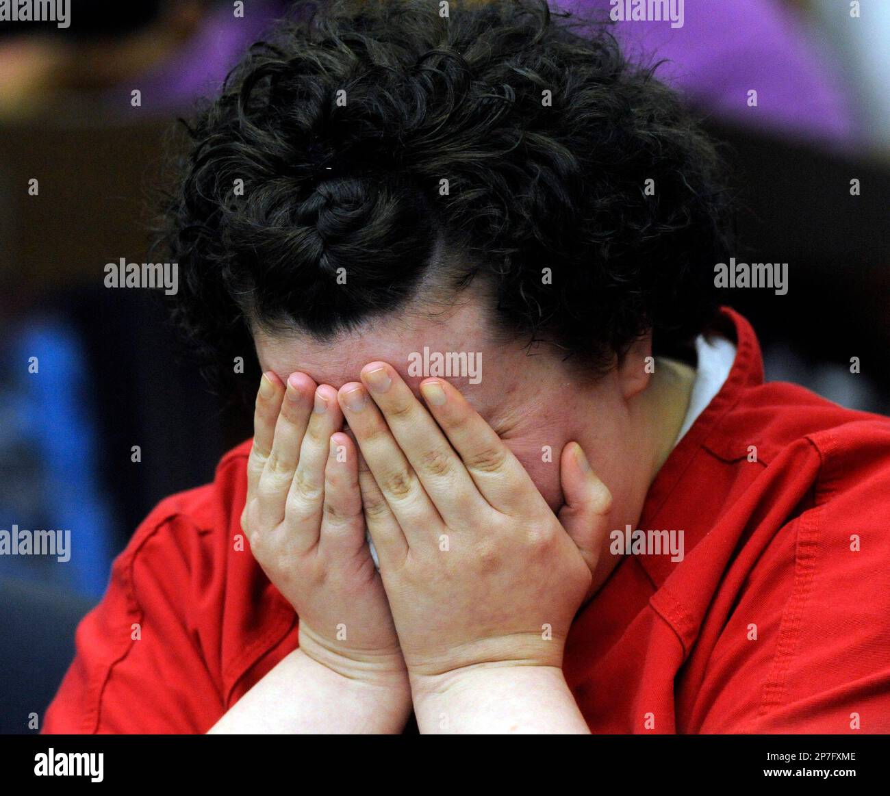 Melissa Huckaby, 29 wipes away tears after watching a multimedia ...