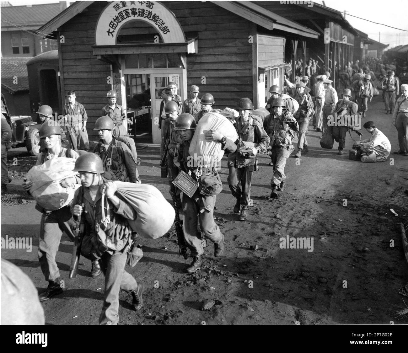 FILE - In this July 5, 1950 file photo, American soldiers leave the ...