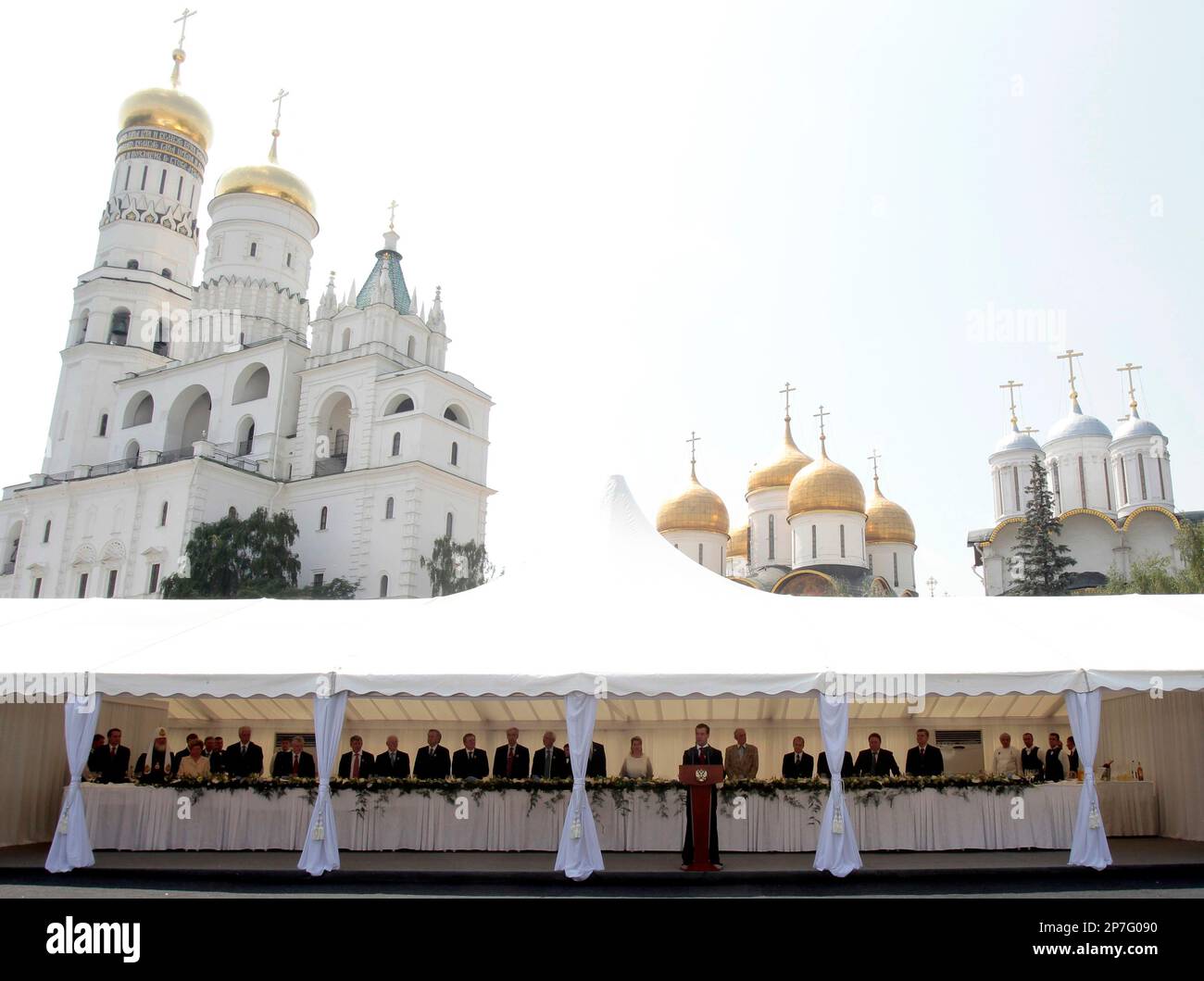 Russia's President Dmitry Medvedev, behind red podium, speaks during a ...