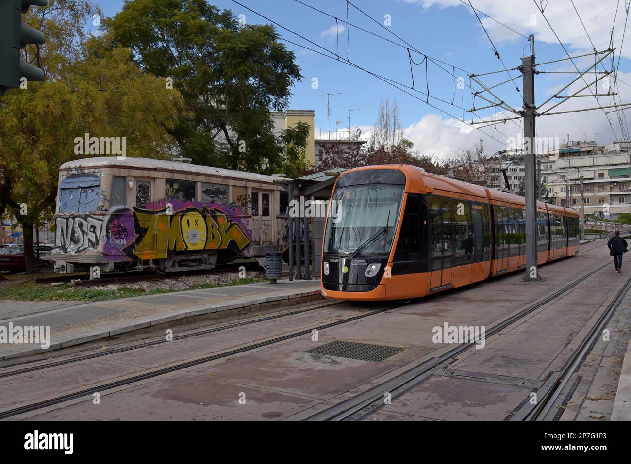 An Athens tram stops at Kasomouli Park tram stop next to a disused tram ...