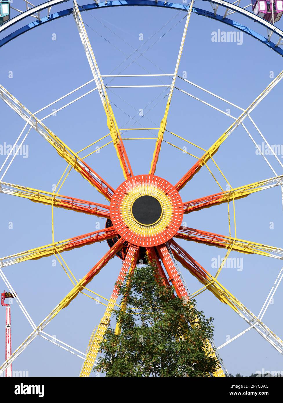 colorful booths and fun rides at a fairground Stock Photo - Alamy