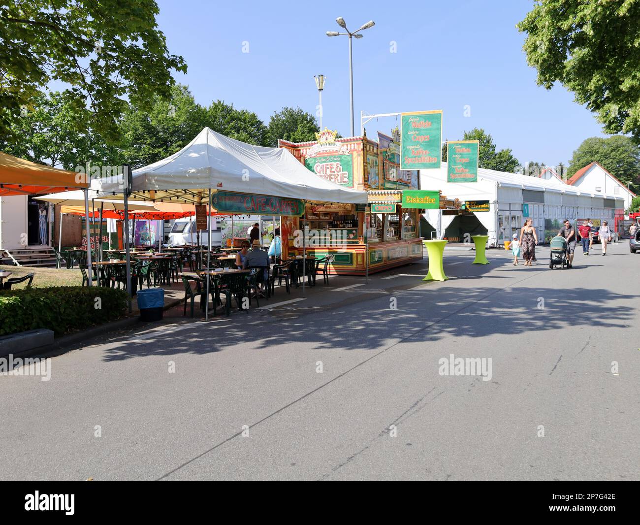 colorful booths and fun rides at a fairground Stock Photo - Alamy